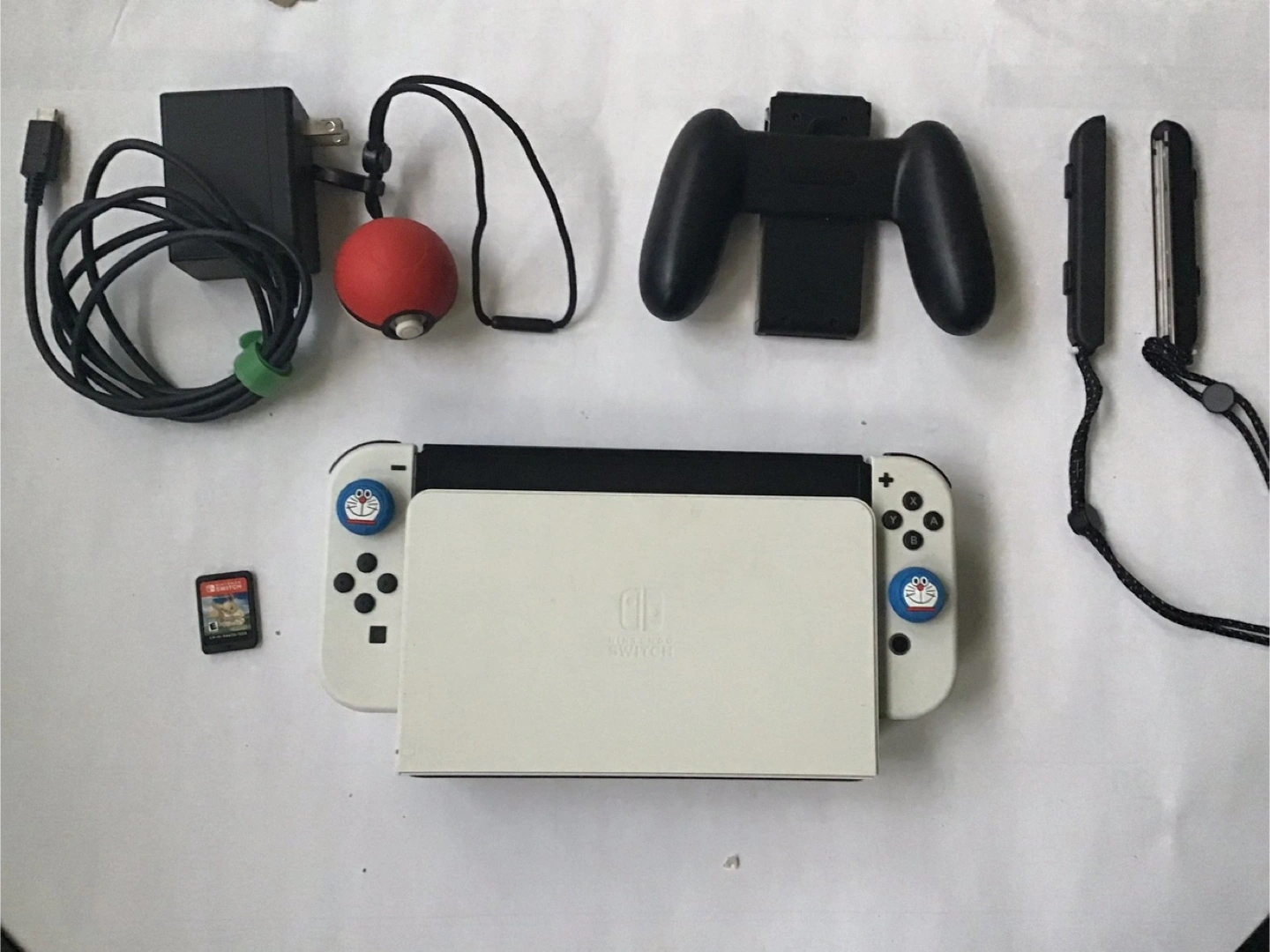 Nintendo Switch OLED with pokeball controller and let’s go eevee | Karrot
