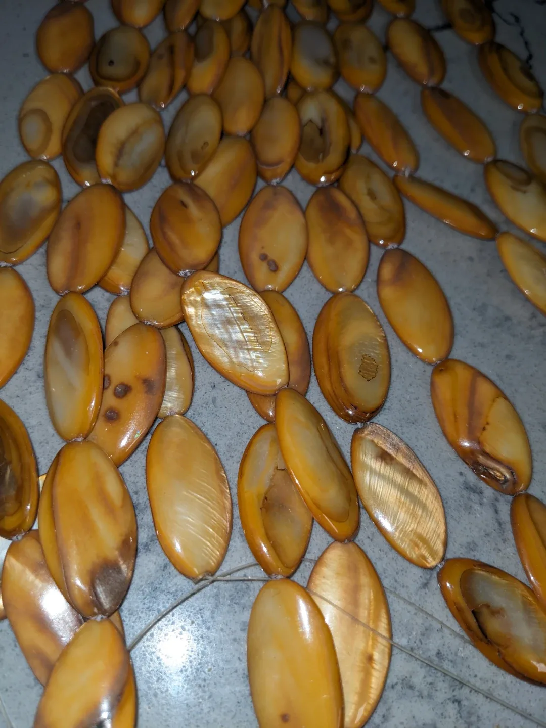 Burnt orange flat oval 30mm shell beads | Karrot